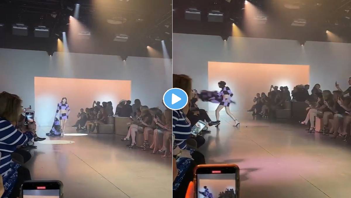 model hits audience member with her coat while walking on the ramp ...